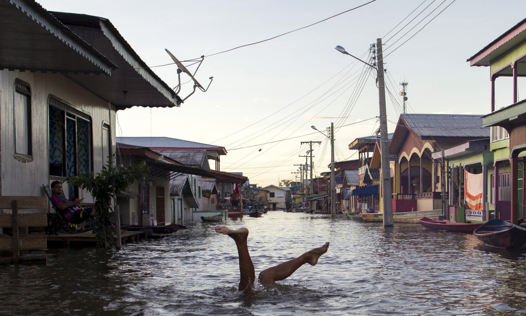 Photos: Amazon River overflows into Brazil’s streets | PBS News Weekend