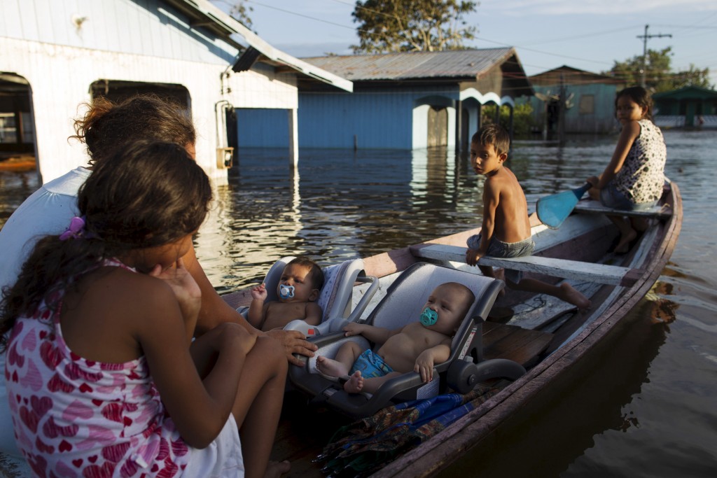 Photos: Amazon River overflows into Brazil’s streets | PBS News Weekend