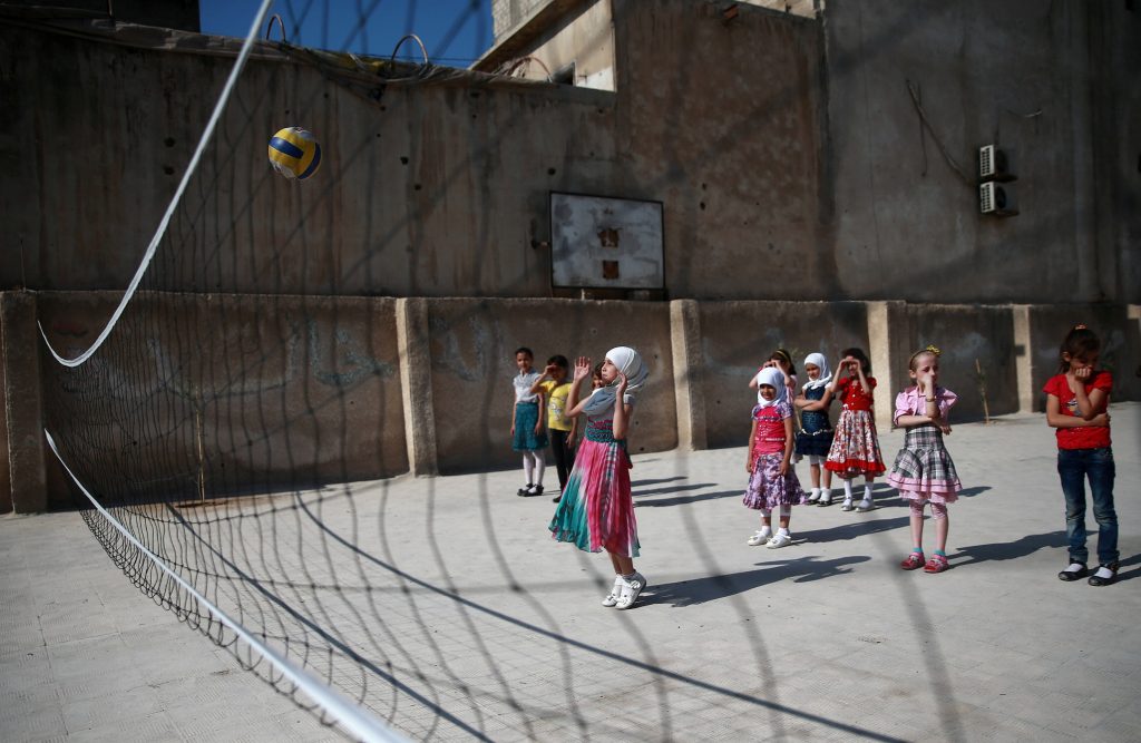 PHOTOS: How Syrian kids play and cool off outside war zones | PBS News