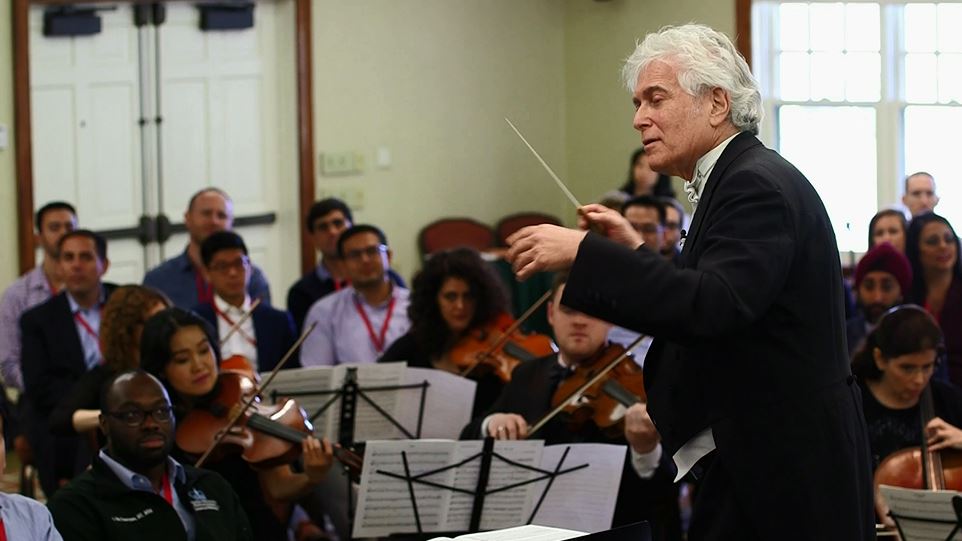 What orchestras can teach executives about conducting business | PBS News