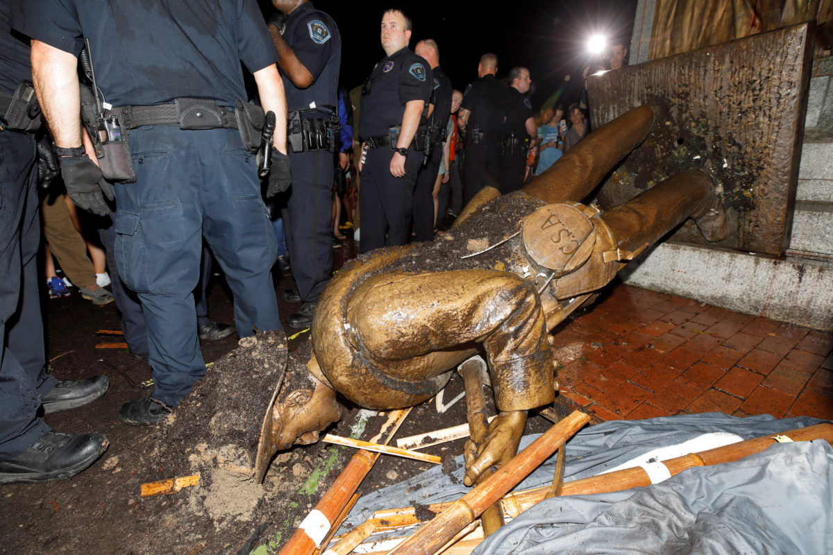 7 arrested in protest over torn-down Confederate statue | PBS News