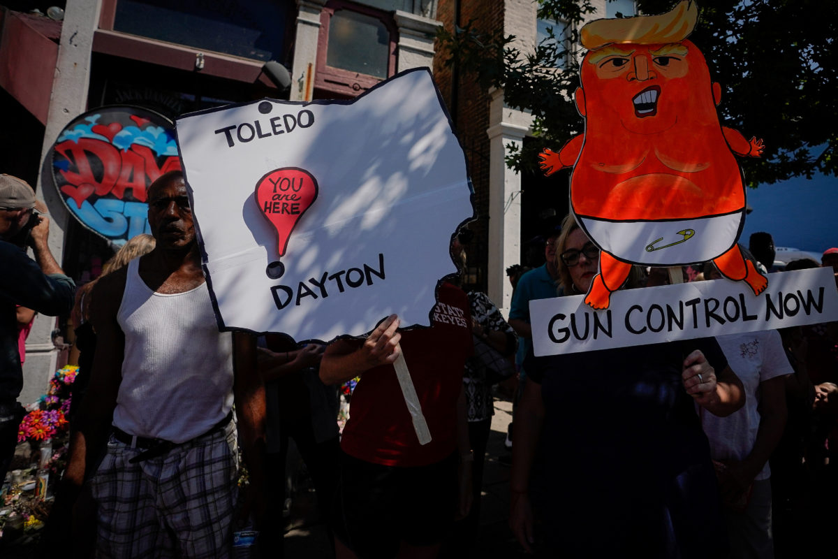 Protesters chant for action on guns as Trump visits Dayton | PBS NewsHour