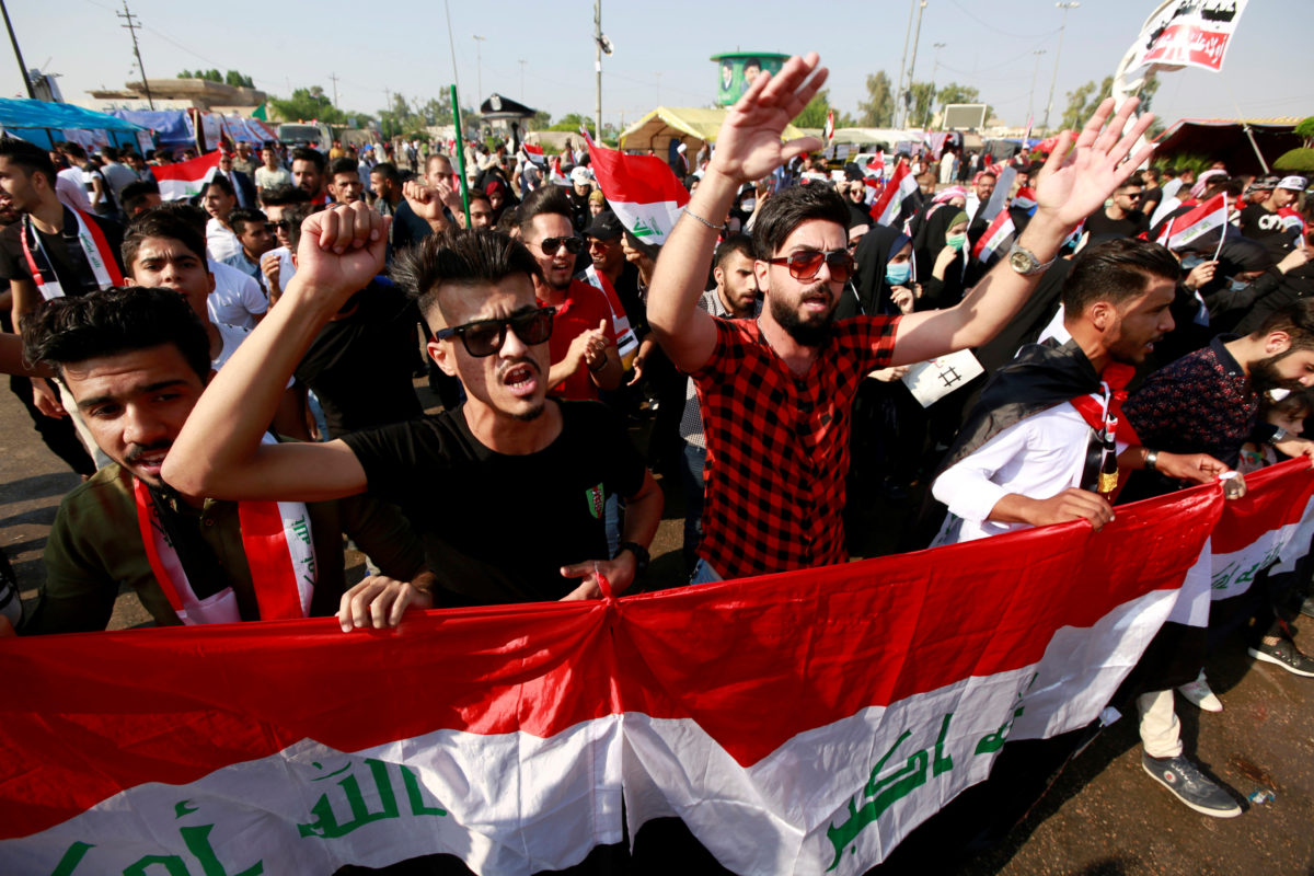 Iraq president bows to protesters and calls for new voting law | PBS ...