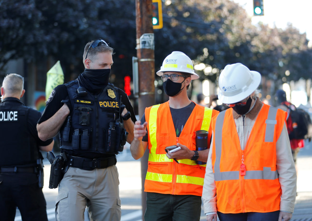 Demonstrators resist as crews arrive at Seattle protest zone | PBS NewsHour