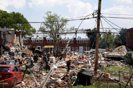 Hundreds help clean up site of fatal Baltimore explosion | PBS News