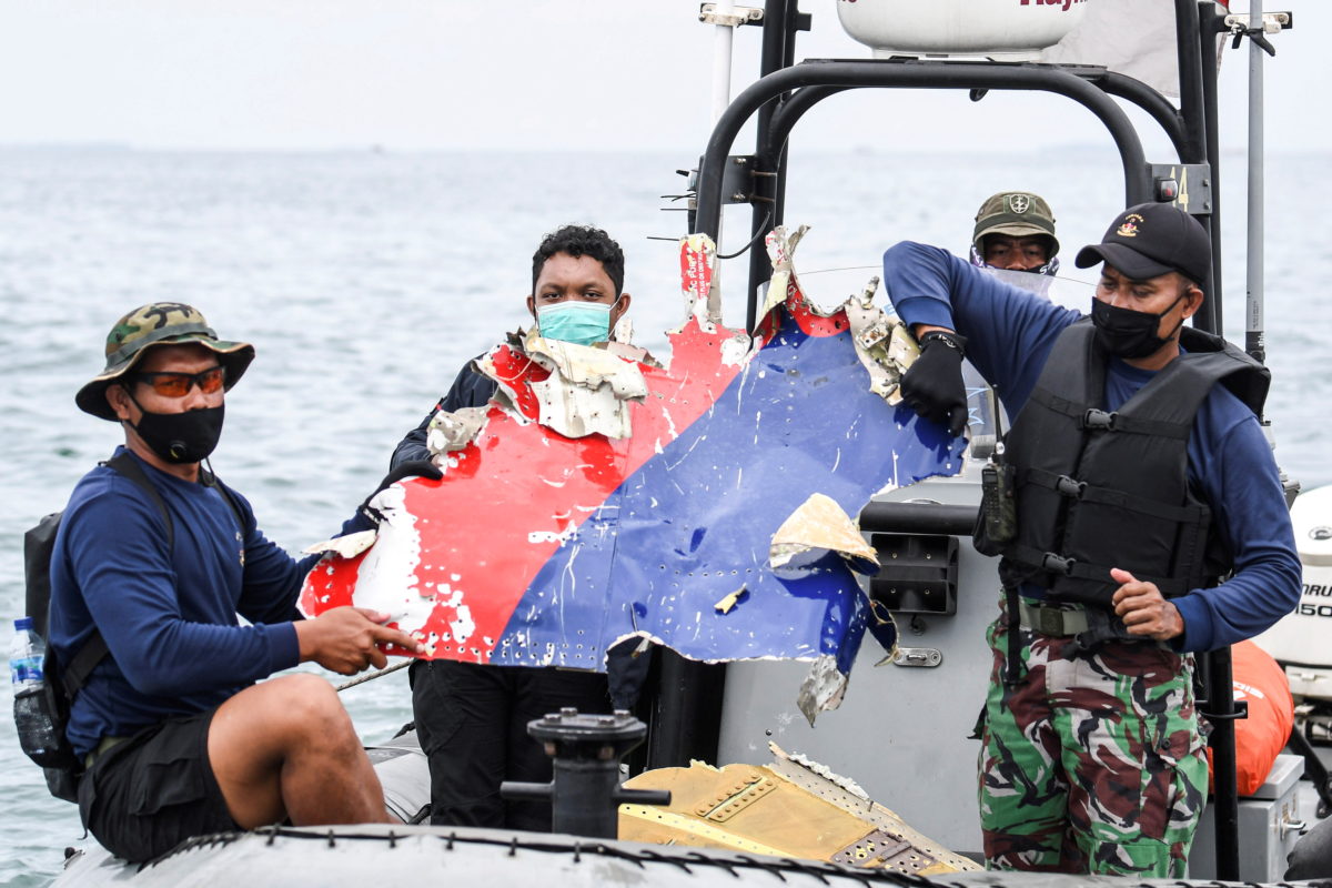 Indonesian divers find parts of plane wreckage in Java Sea | PBS News ...
