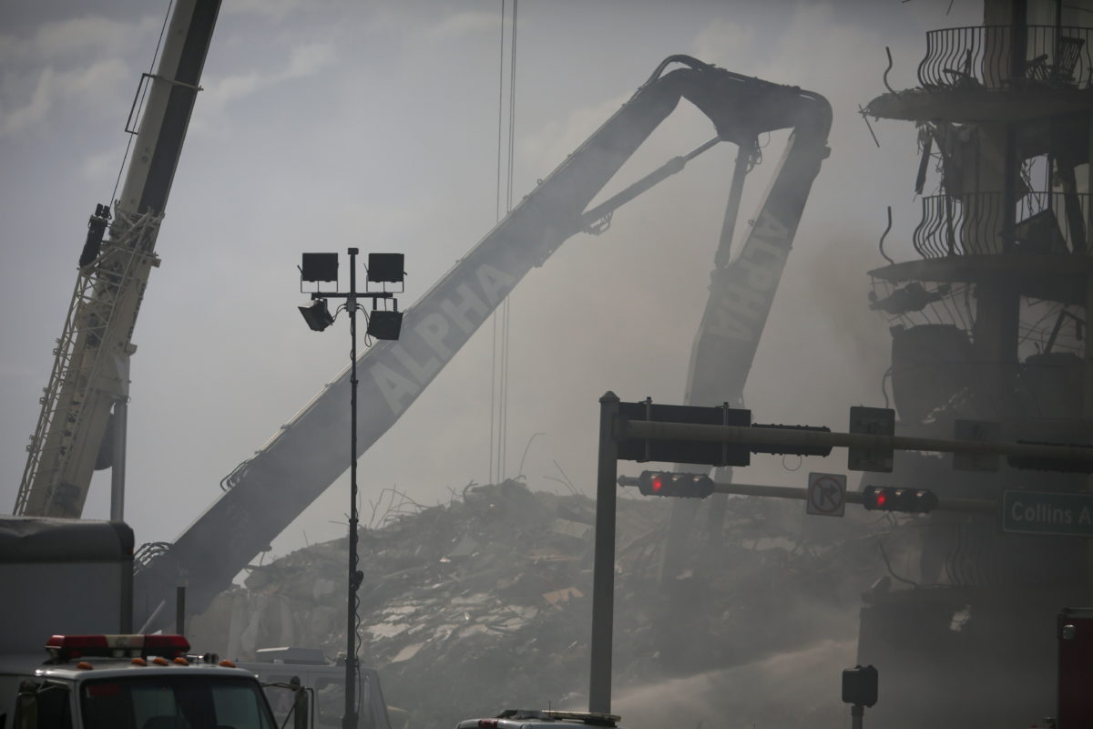 Flames hamper rescue effort amid rubble of Florida condo | PBS News Weekend