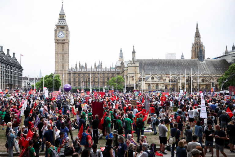 Thousands march in London to protest surging costs | PBS News