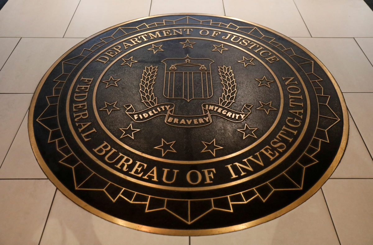 Woman taken into custody after armed standoff at FBI building in ...