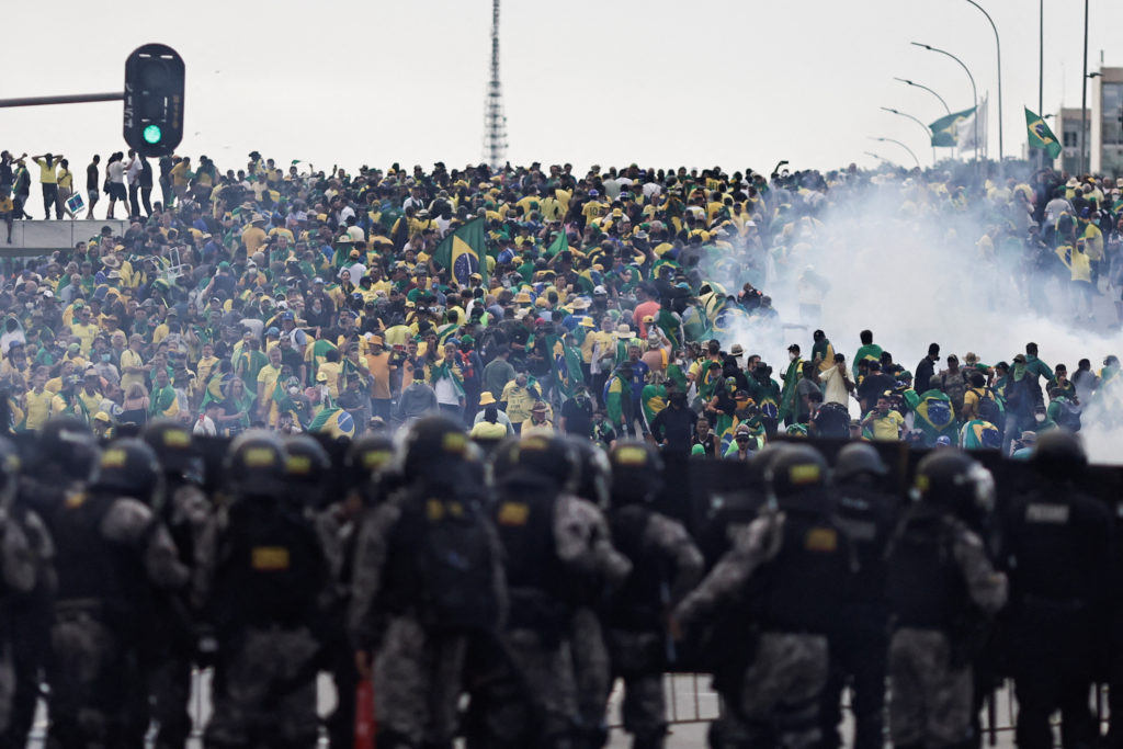 Supporters of defeated far-right president storm government buildings ...