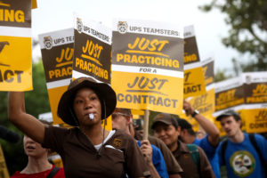 UPS workers approve 5-year contract agreement to end negotiations | PBS ...