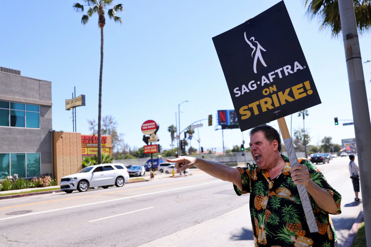 Movie and TV stars join writers on the picket line in fight over the ...