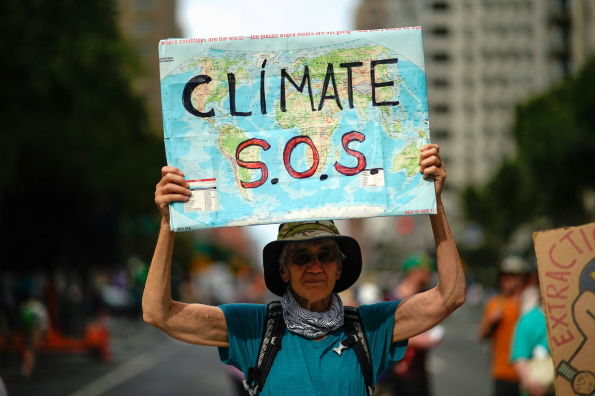 PHOTOS: Tens of thousands of activists march to kick off climate summit ...