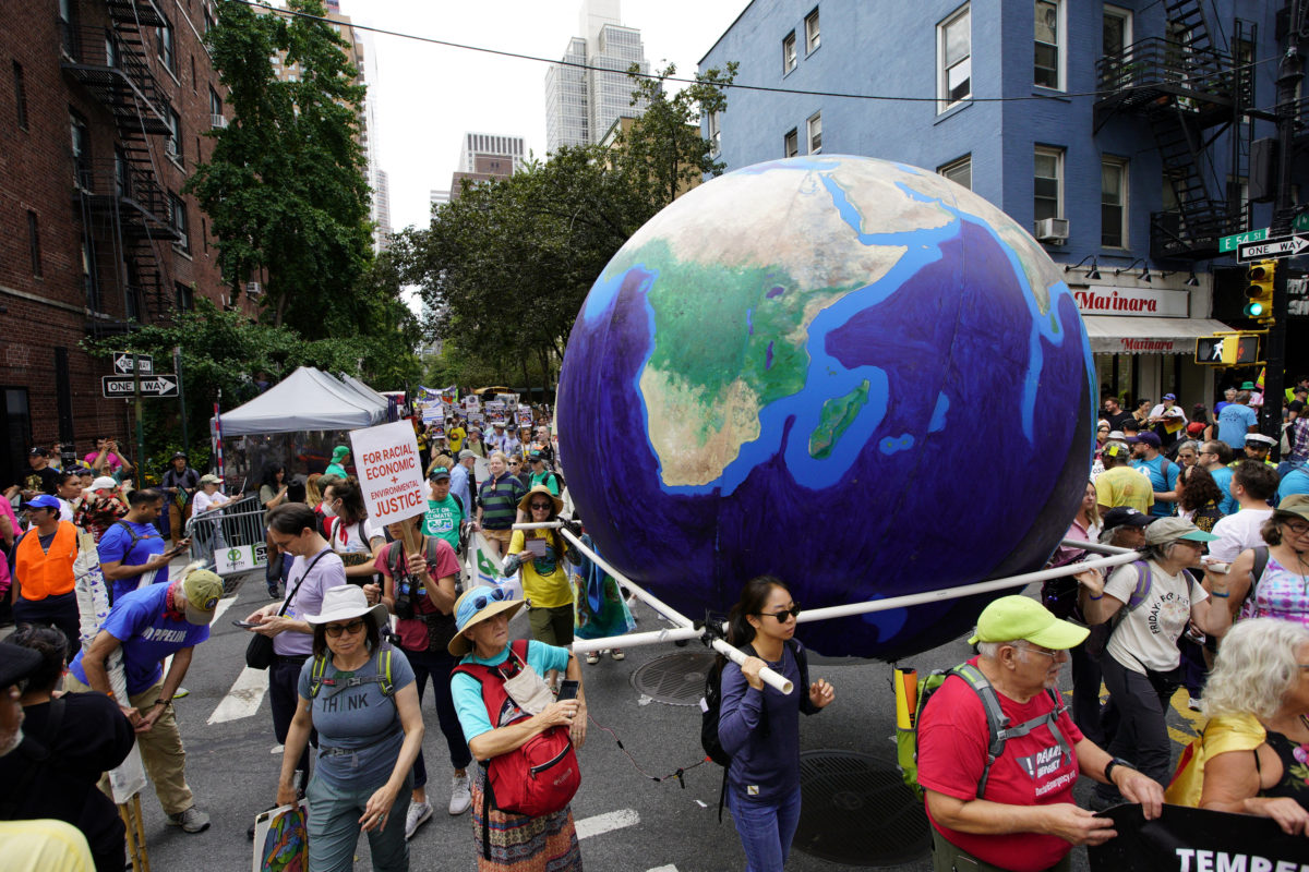 PHOTOS: Tens of thousands of activists march to kick off climate summit ...