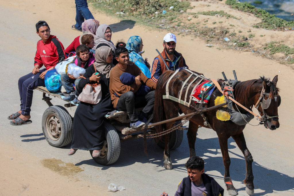News Wrap: Palestinians displaced by war move toward northern Gaza ...