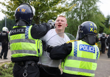 UK police clash with far-right rioters who tried to storm hotel housing ...
