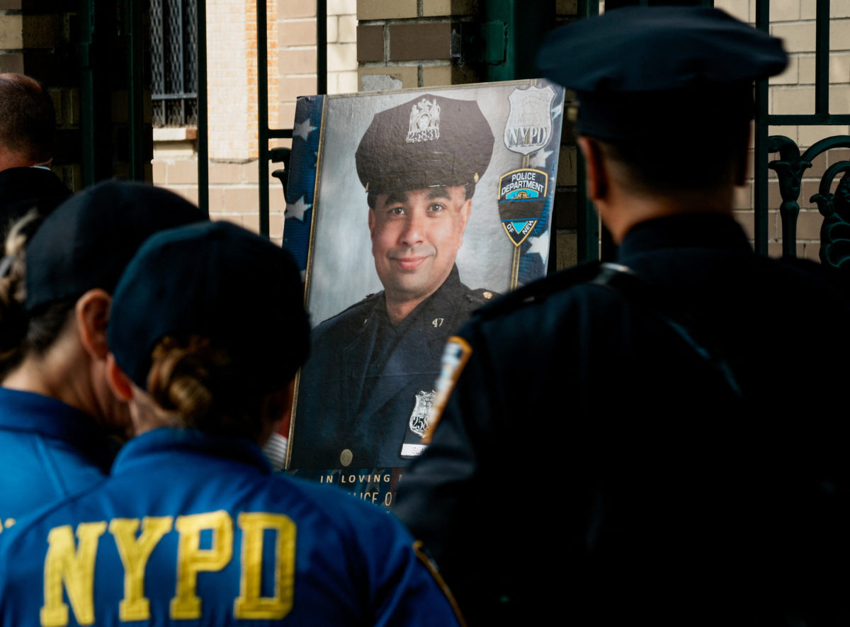 Funeral held for NYPD officer killed in shooting at NFL headquarters ...