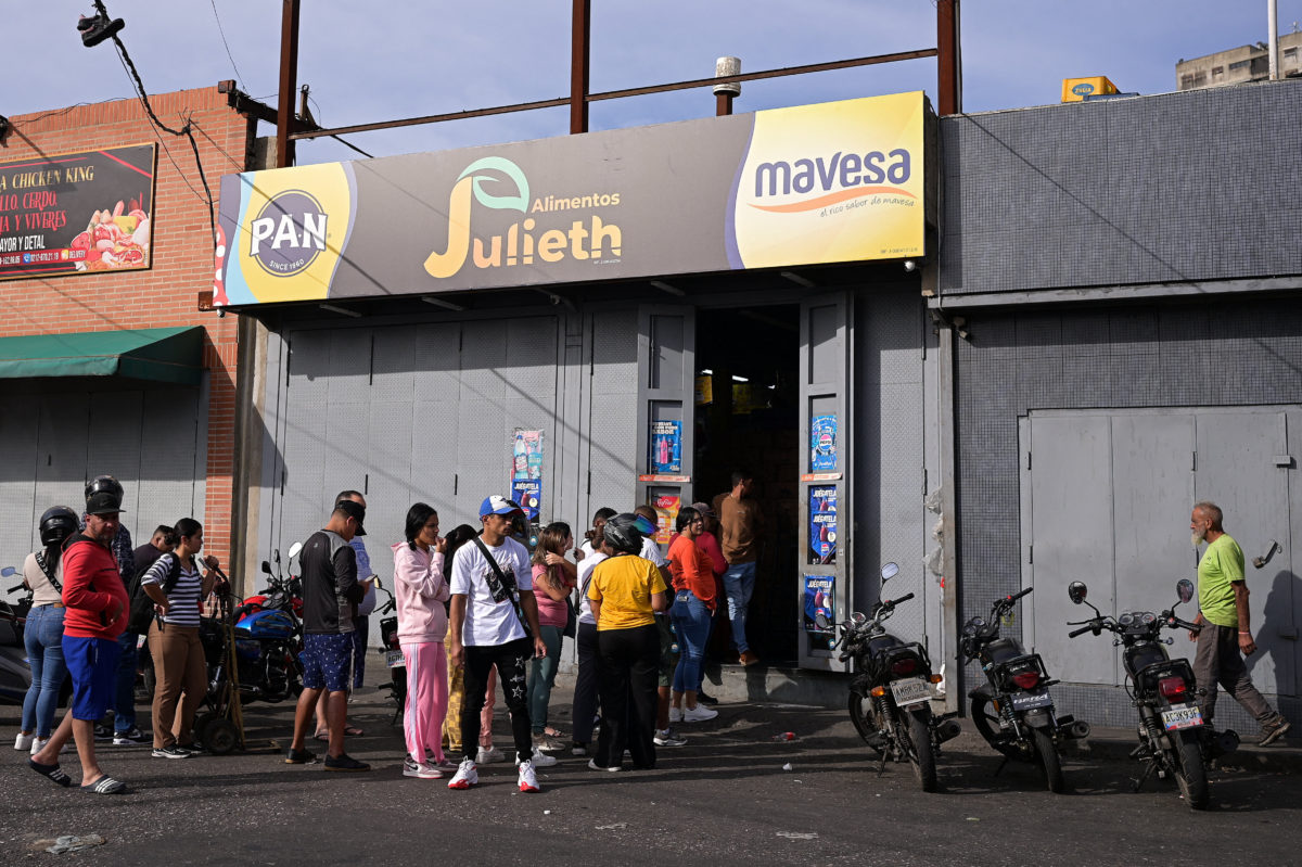Venezuelans struggle with crumbling economy as Trump promises economic ...